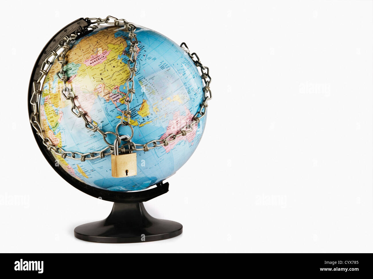 Globe with chains around it Stock Photo - Alamy