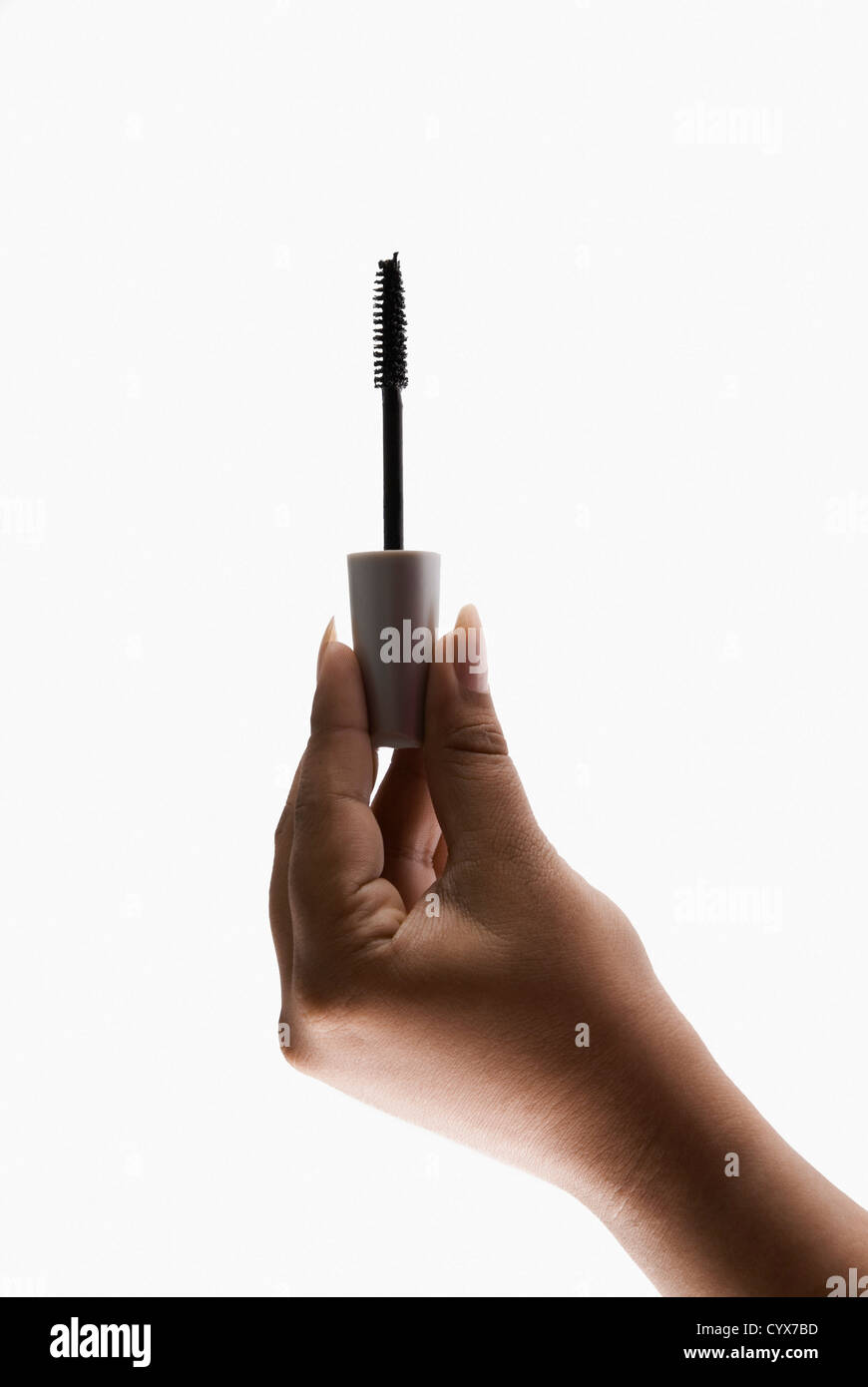 Close-up of a woman's hand holding a mascara brush Stock Photo - Alamy