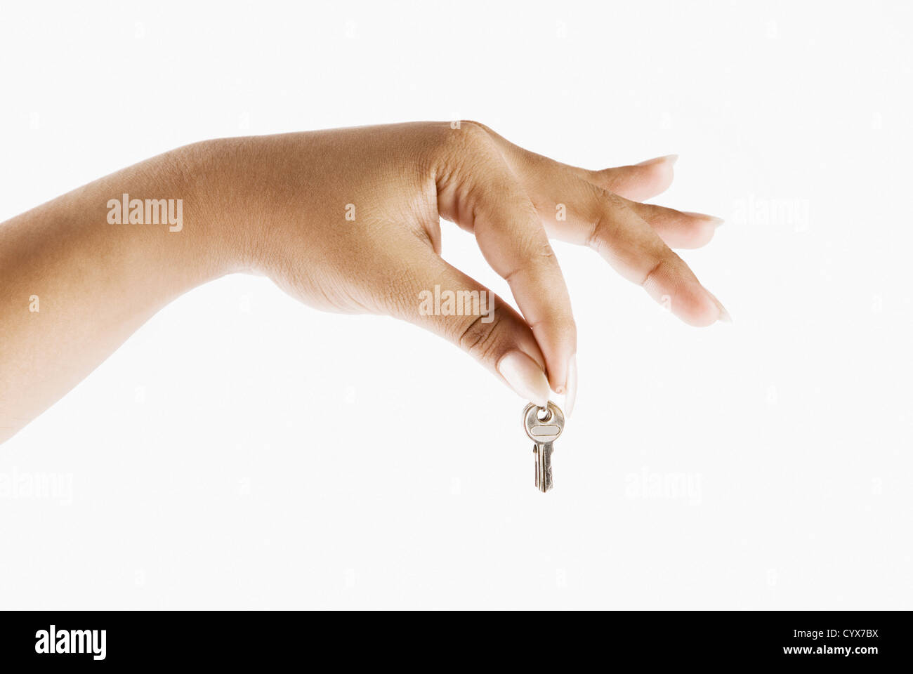 Close-up of a woman's hand holding a key Stock Photo - Alamy