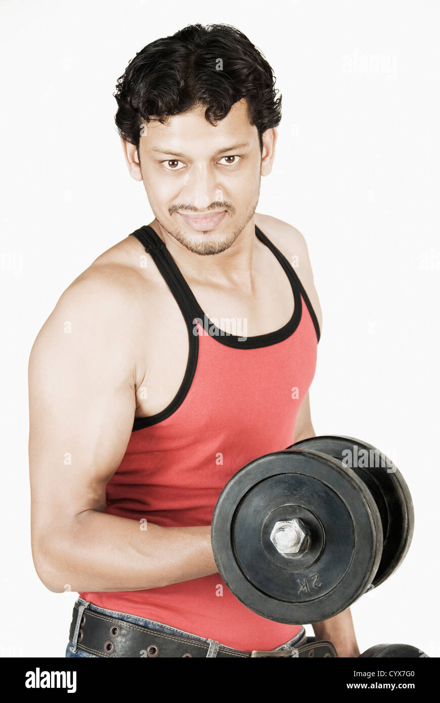 Man exercising with dumbbells Stock Photo - Alamy