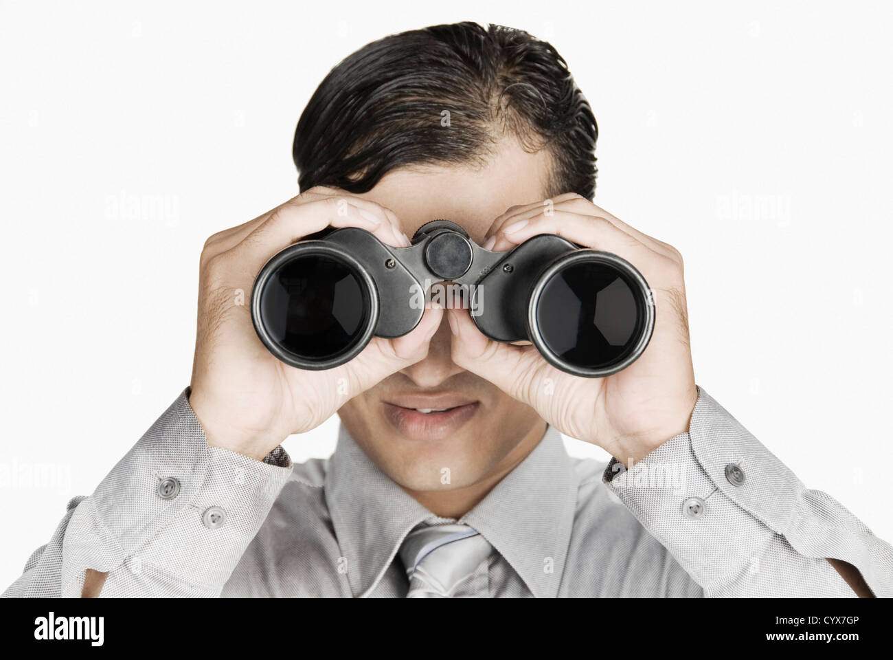 Businessman looking through binoculars Stock Photo - Alamy