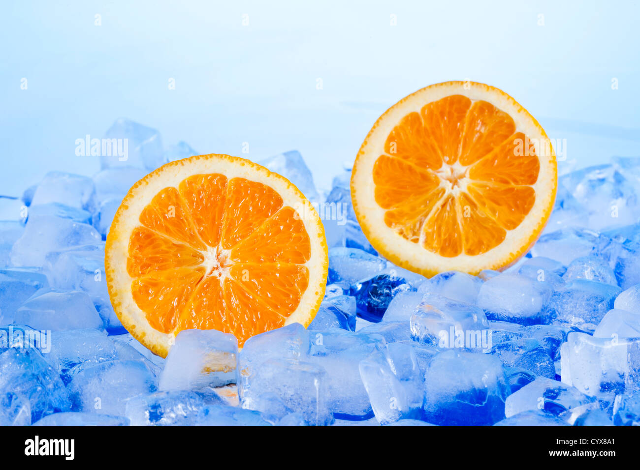 Fresh orange and ice cubes Stock Photo - Alamy