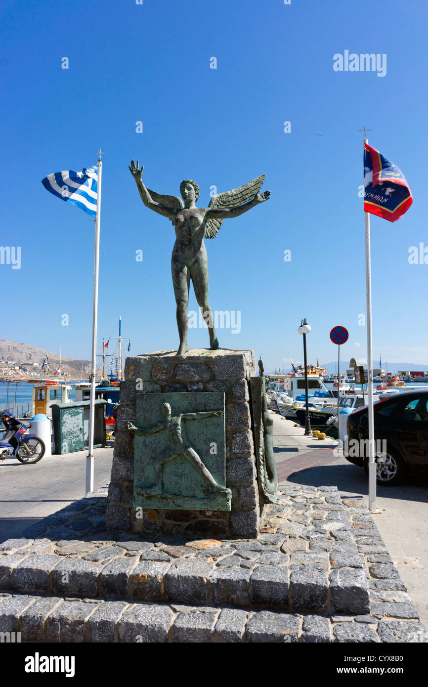 Winged bronze statue, flag Pothia Kalymnos, Greece Stock Photo - Alamy