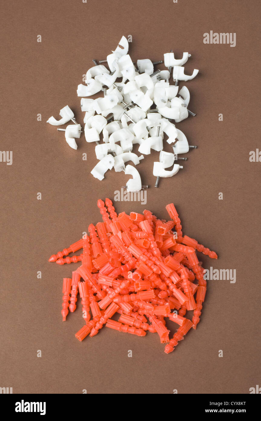 Close-up of nail clips and plastic anchors Stock Photo - Alamy