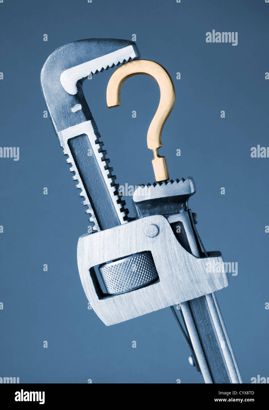 Adjustable wrench crushing question mark symbol Stock Photo - Alamy