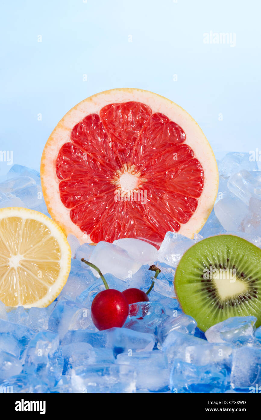 Freshly sliced fruits on ice Stock Photo - Alamy
