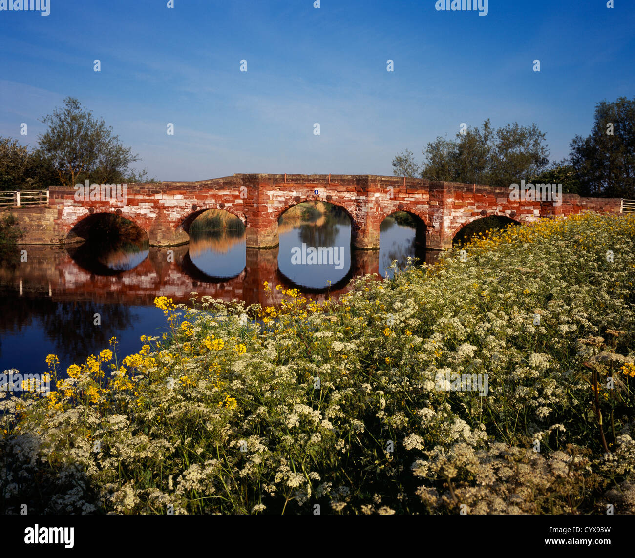 Old sandstone road bridge across the River Avon near village of ...