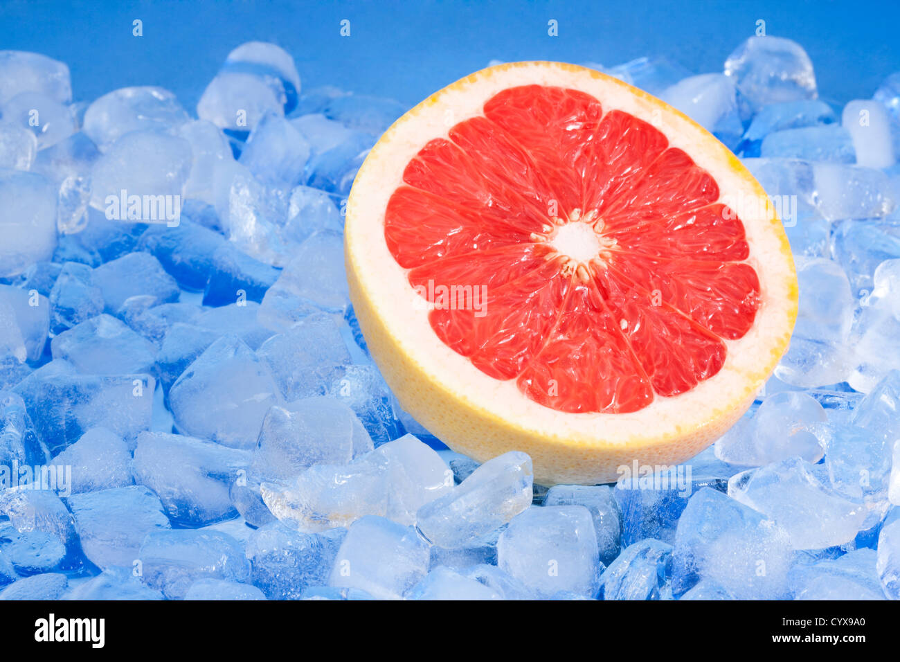 Freshly sliced grapefruit on ice Stock Photo - Alamy