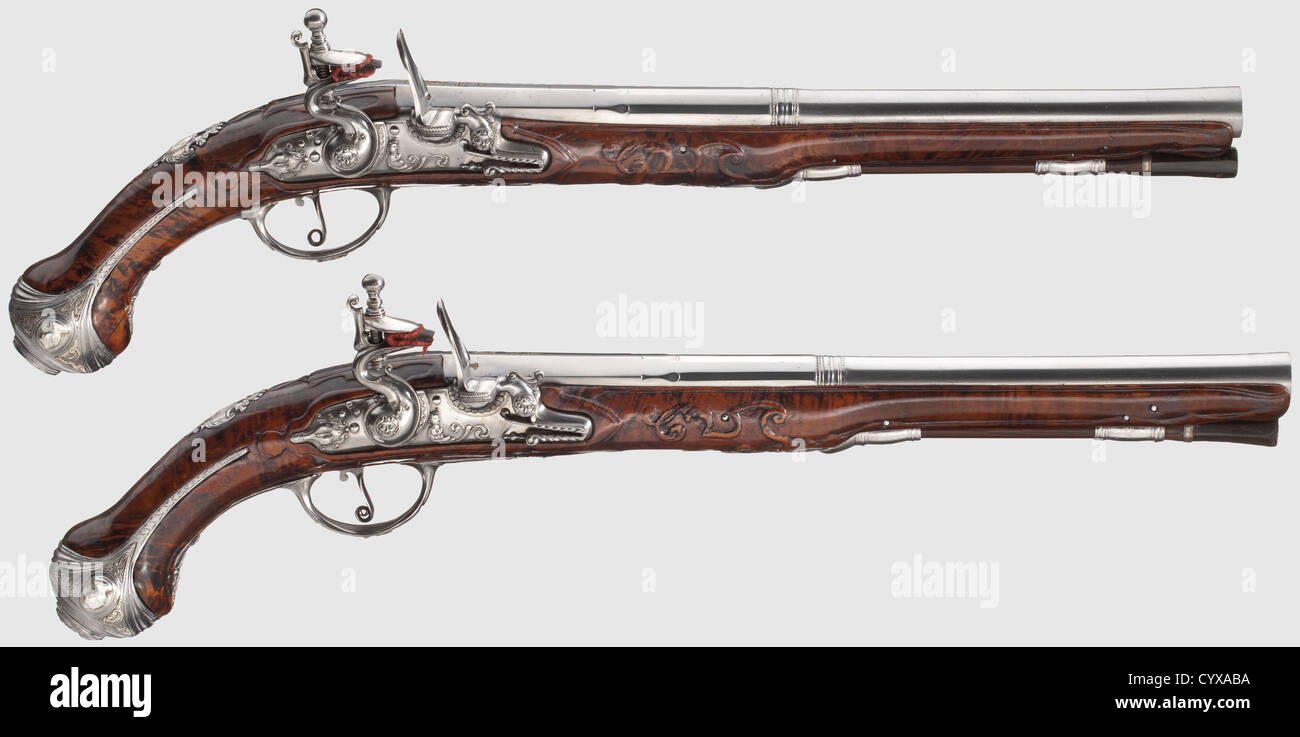 A pair of Italian long flintlock pistols,circa 1730. At the breeches ...