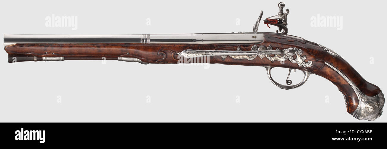 A pair of Italian long flintlock pistols,circa 1730. At the breeches ...