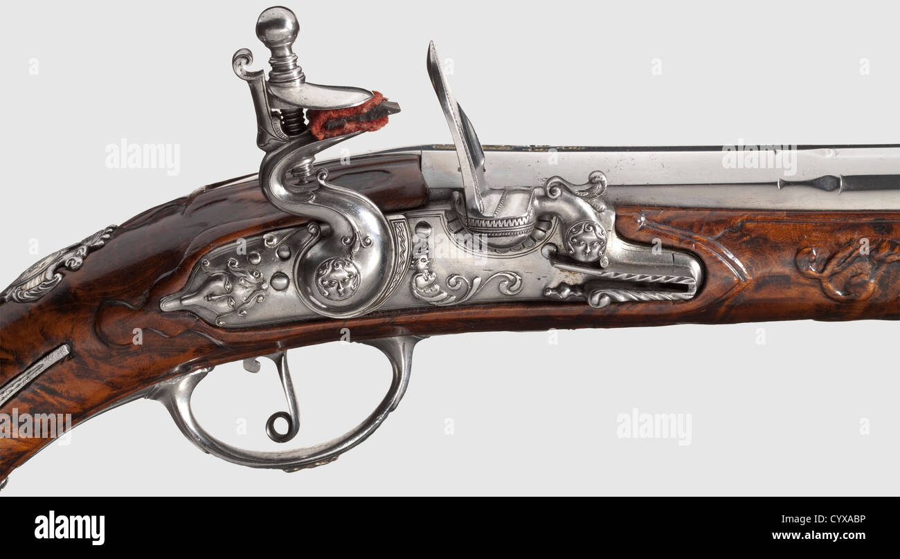 A pair of Italian long flintlock pistols,circa 1730. At the breeches ...
