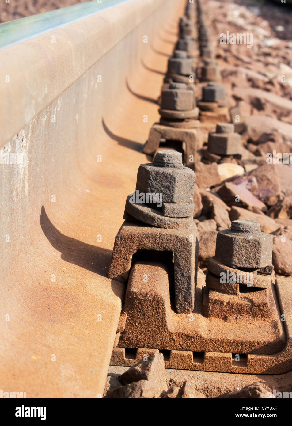 Railroad metal, sleepers and rusty bonding screws Stock Photo - Alamy