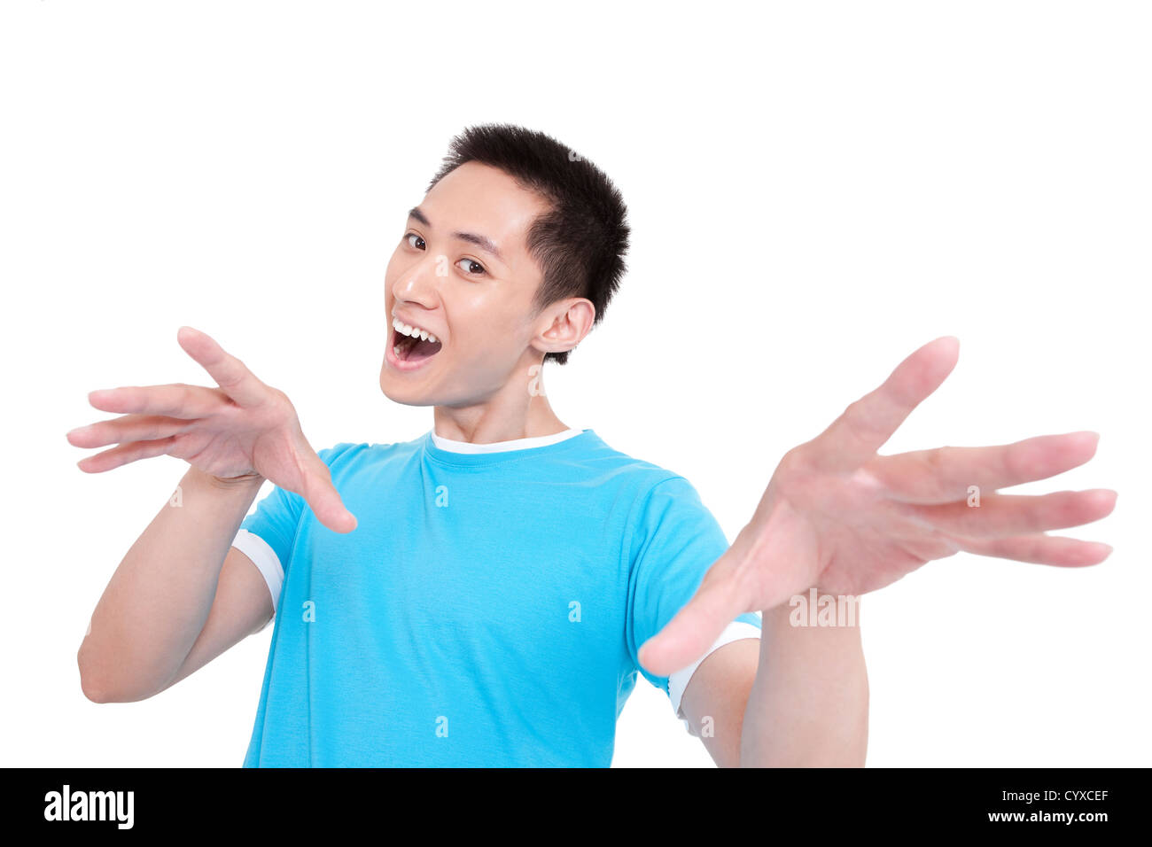 Excited young man gesturing with hands Stock Photo - Alamy