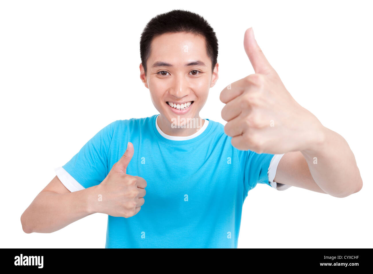 Cheerful young man doing thumbs up Stock Photo - Alamy