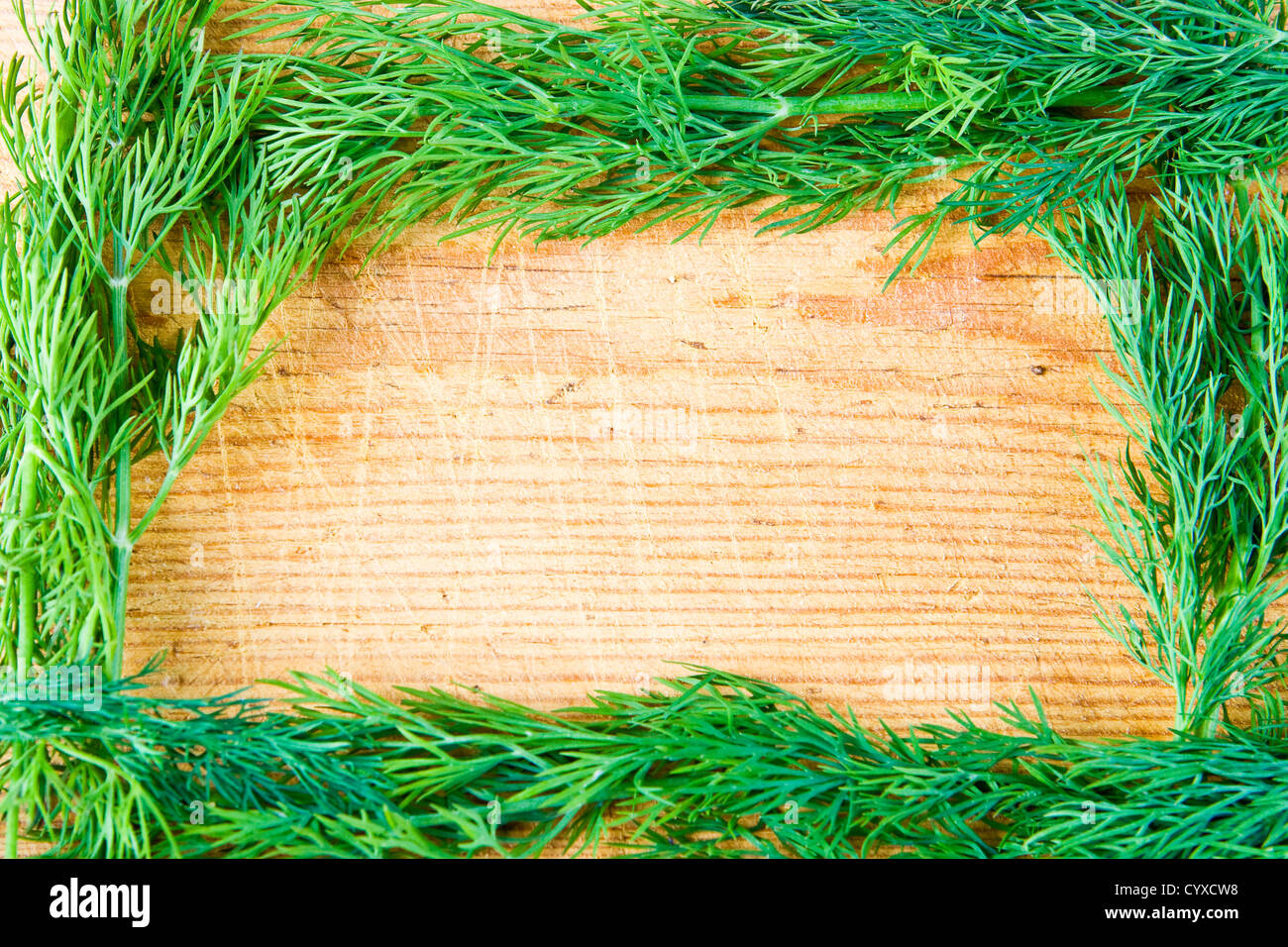 A dill frame on a wooden chopping block Stock Photo - Alamy
