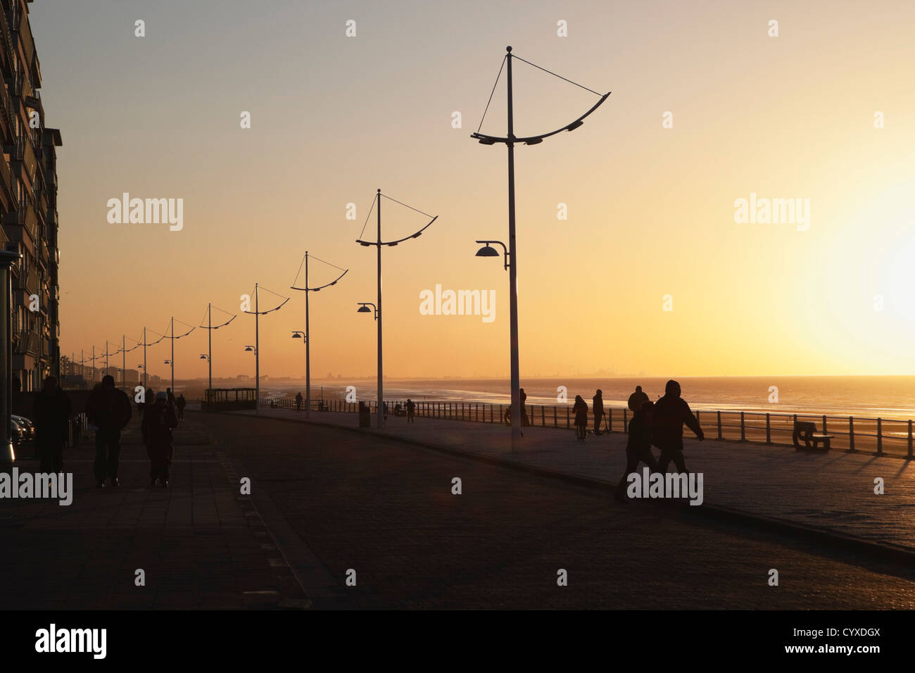 Belgium, Flanders, People walking along beach Stock Photo - Alamy