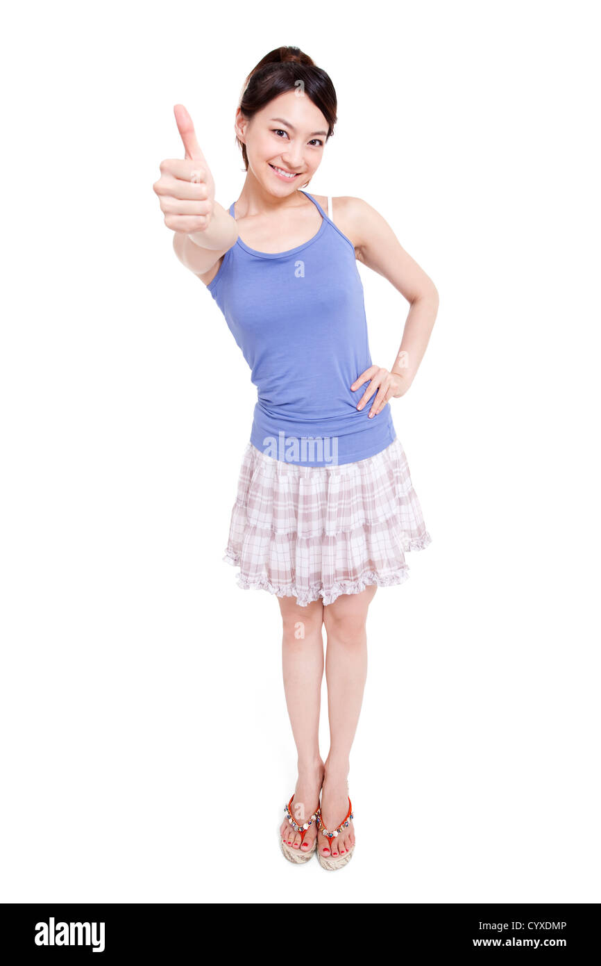 Happy young woman doing thumbs up Stock Photo - Alamy