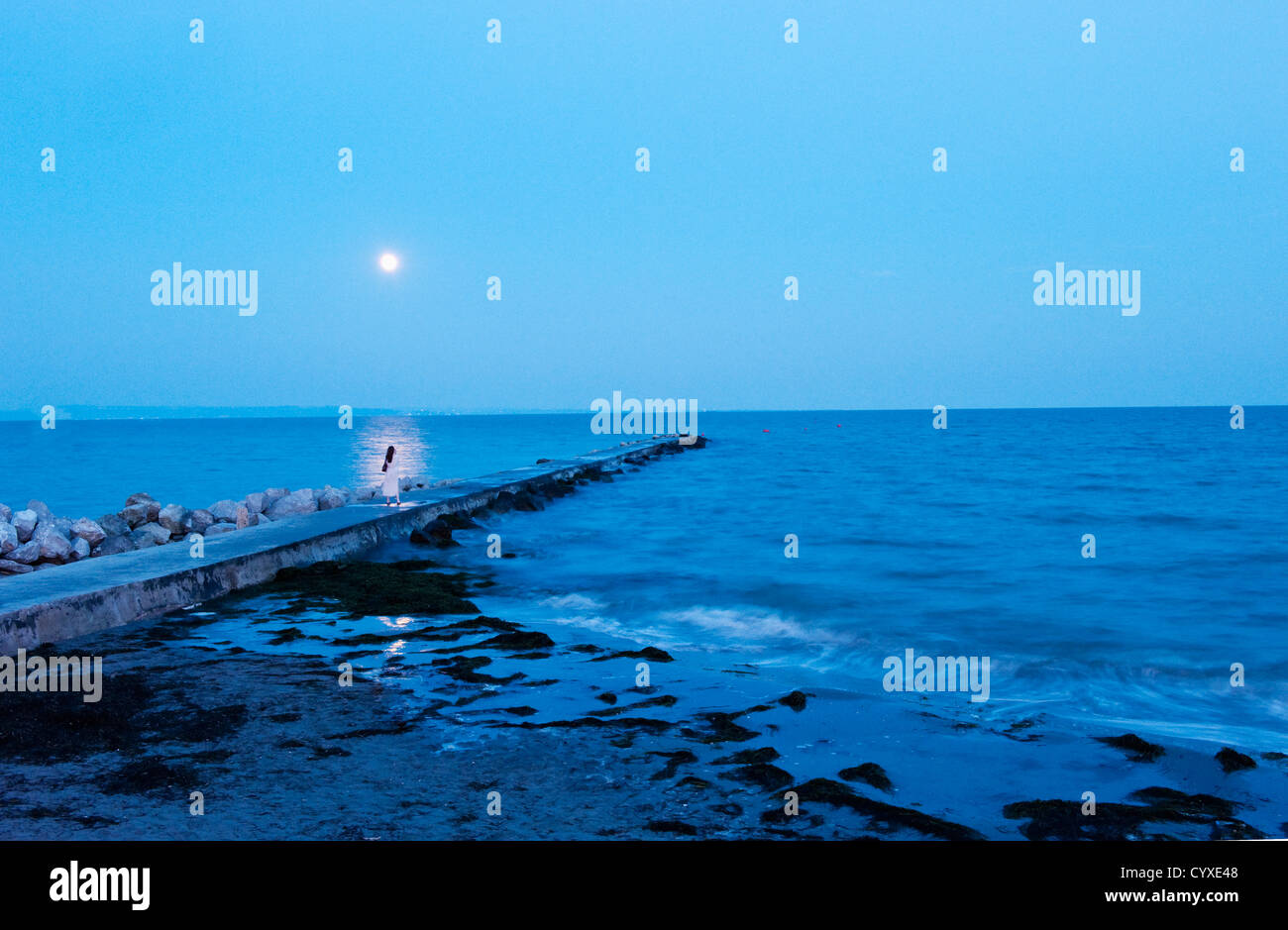 Italy, Friuli, Grado, Person on beach during full moon at night Stock ...