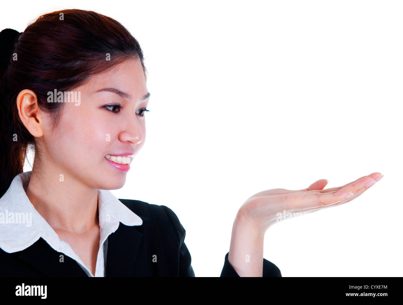 Asian woman showing empty hand, isolated in white Stock Photo - Alamy