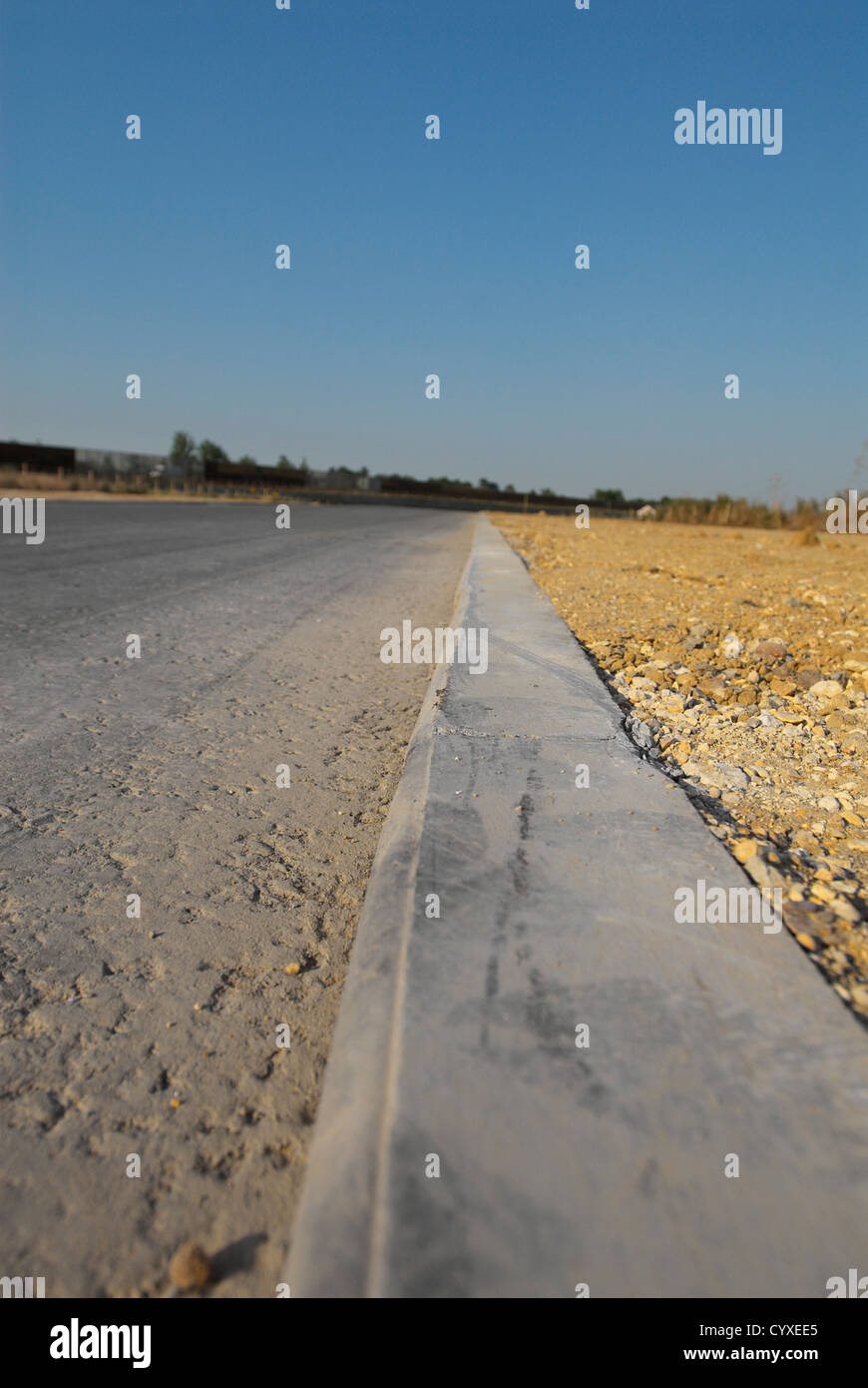 Kerb on newly laid road Stock Photo - Alamy