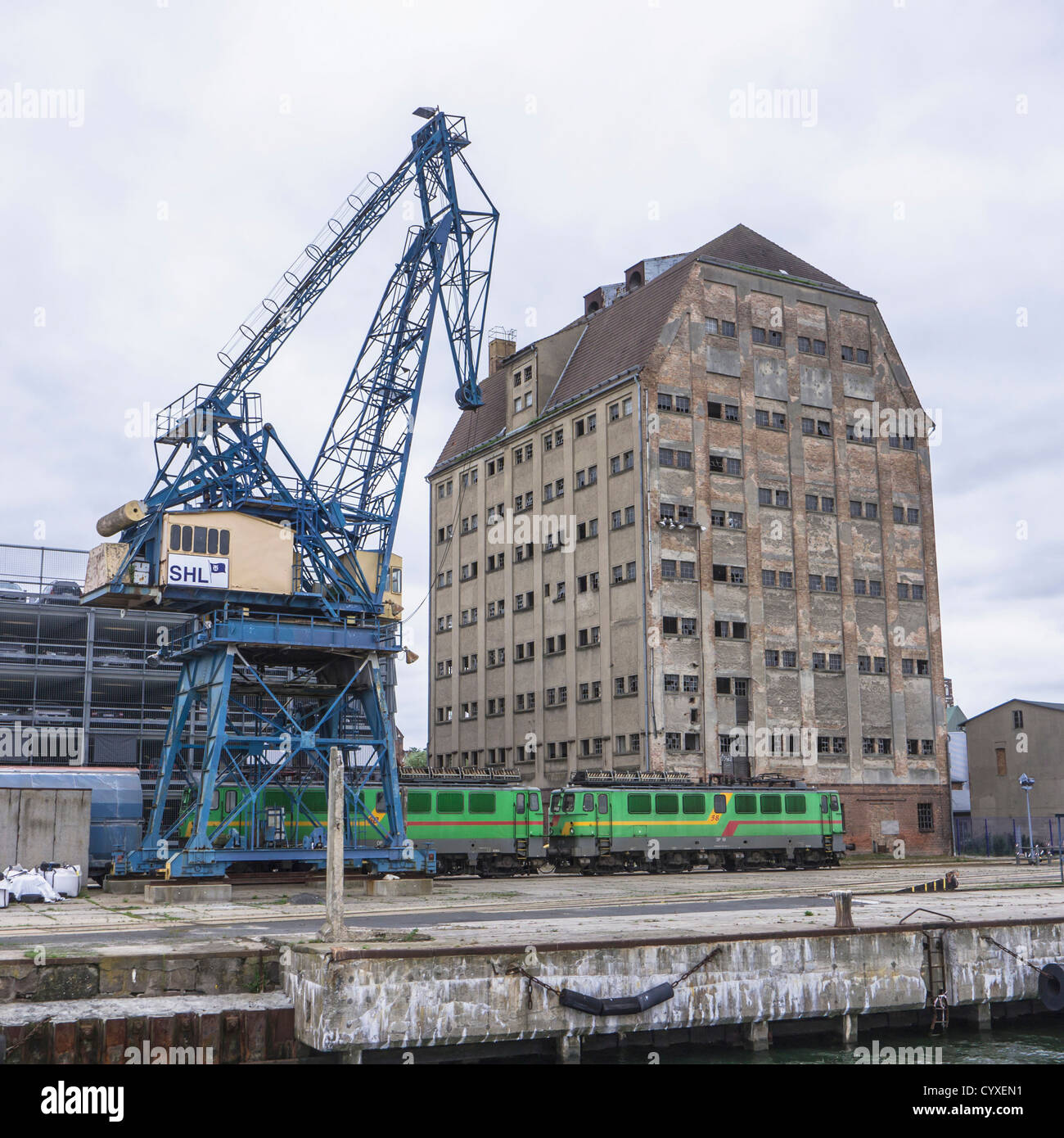 Northern Germany, Crane and train at dock Stock Photo - Alamy