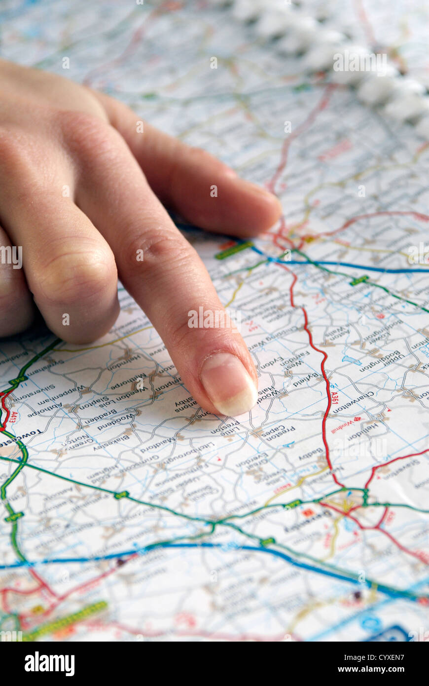 Woman pointing at map Stock Photo - Alamy