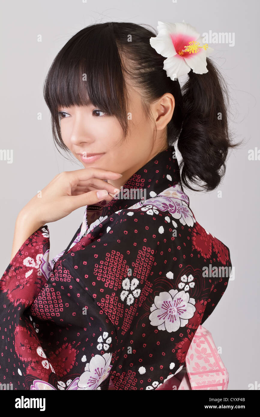 Attractive Asian lady with japanese traditional clothes and smiling ...