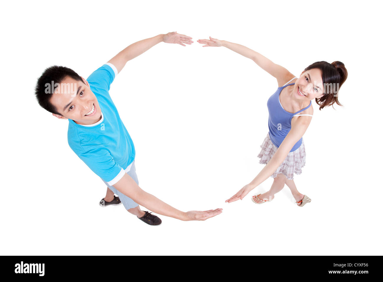 Happy young couple opening arms Stock Photo - Alamy