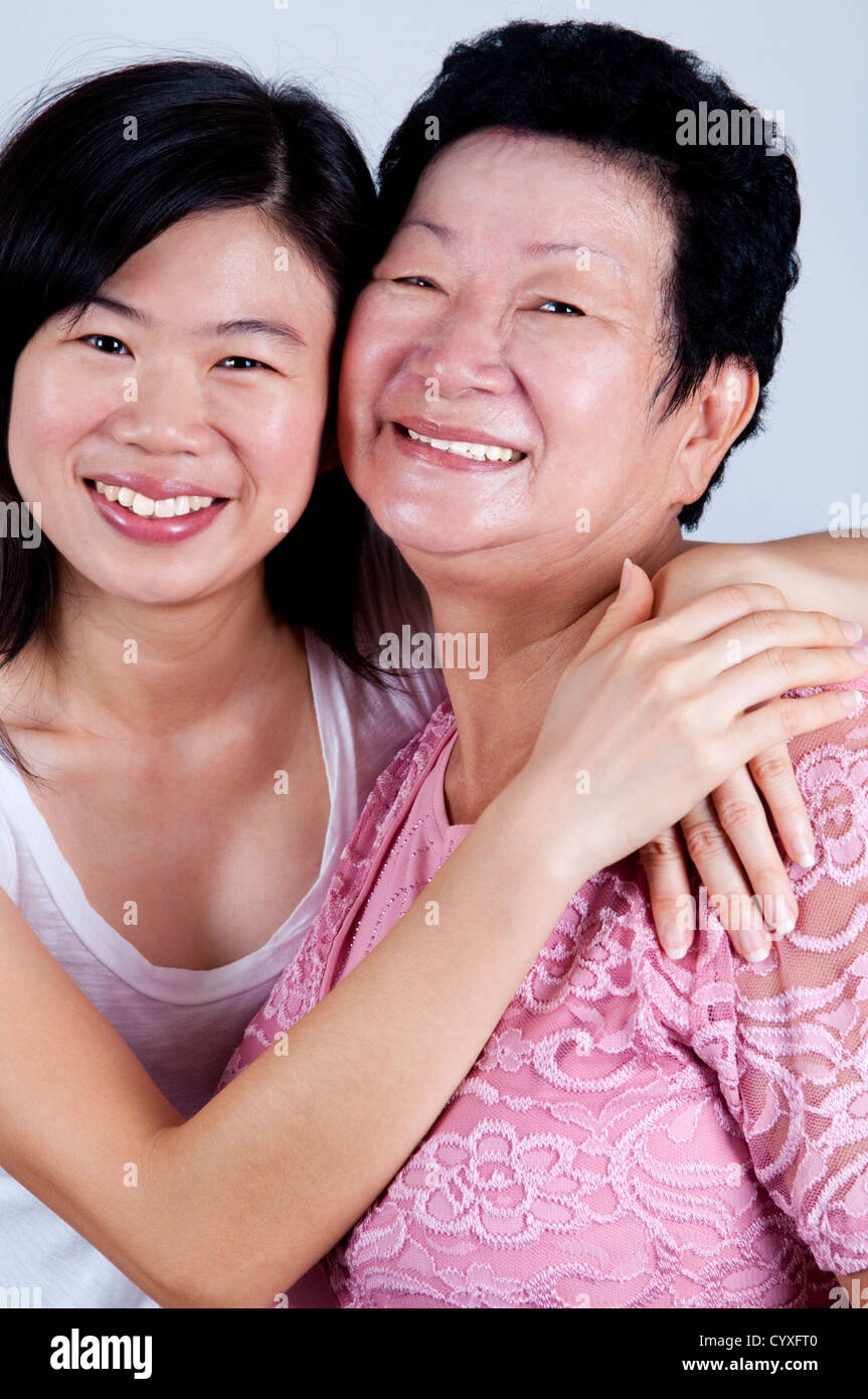Happy Asian Family. Daughter hugging her mother Stock Photo - Alamy