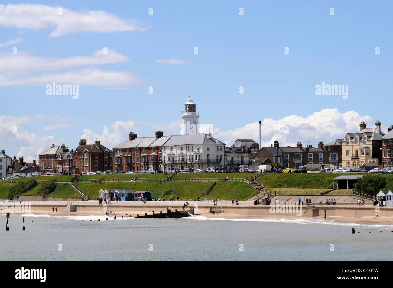 Historic seafront with lighthouse from the pier British Isles Colorful ...