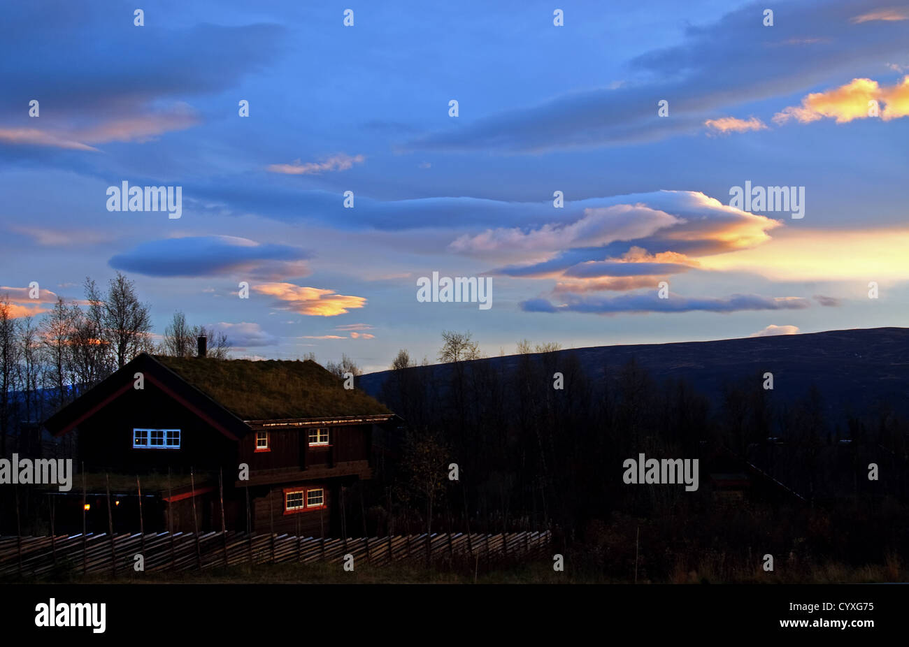 Mountain cabin in sunset Stock Photo - Alamy