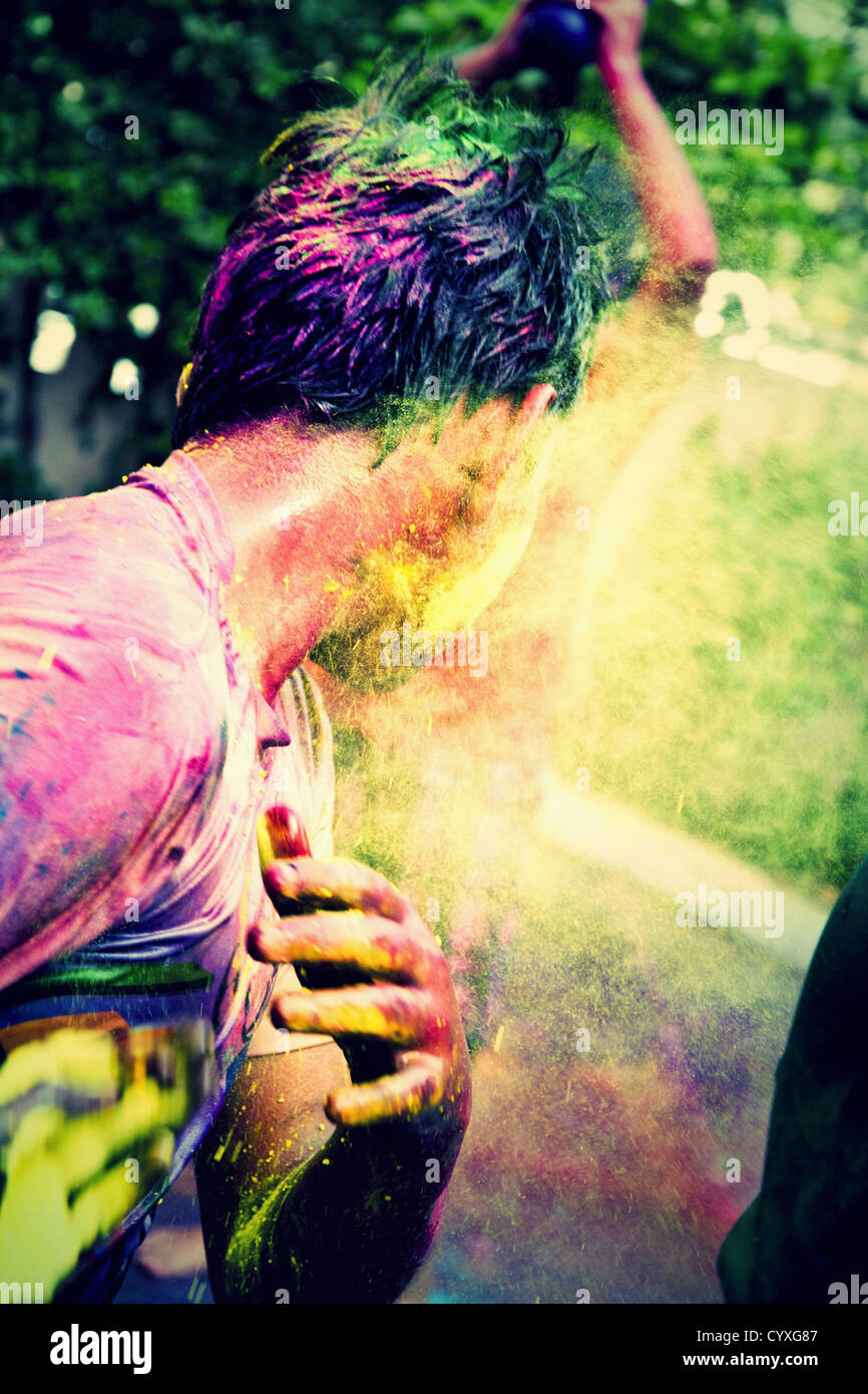 Young man celebrates holi festival hi-res stock photography and images ...