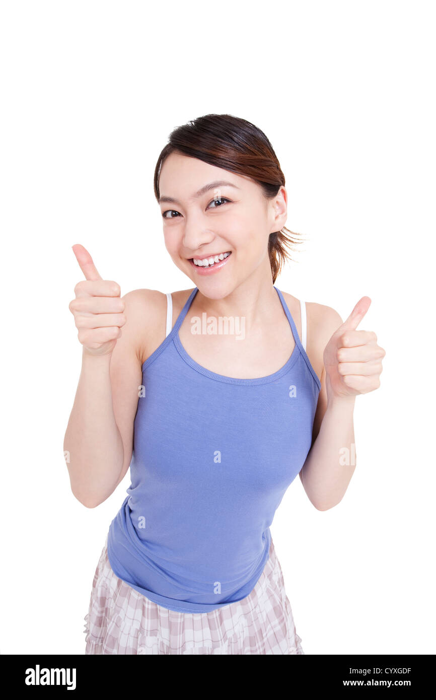 Joyful young woman doing thumbs up Stock Photo - Alamy