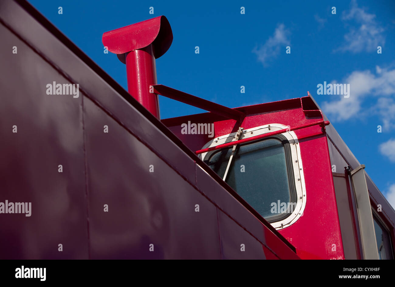 Detail of a shiny red train caboose Stock Photo - Alamy