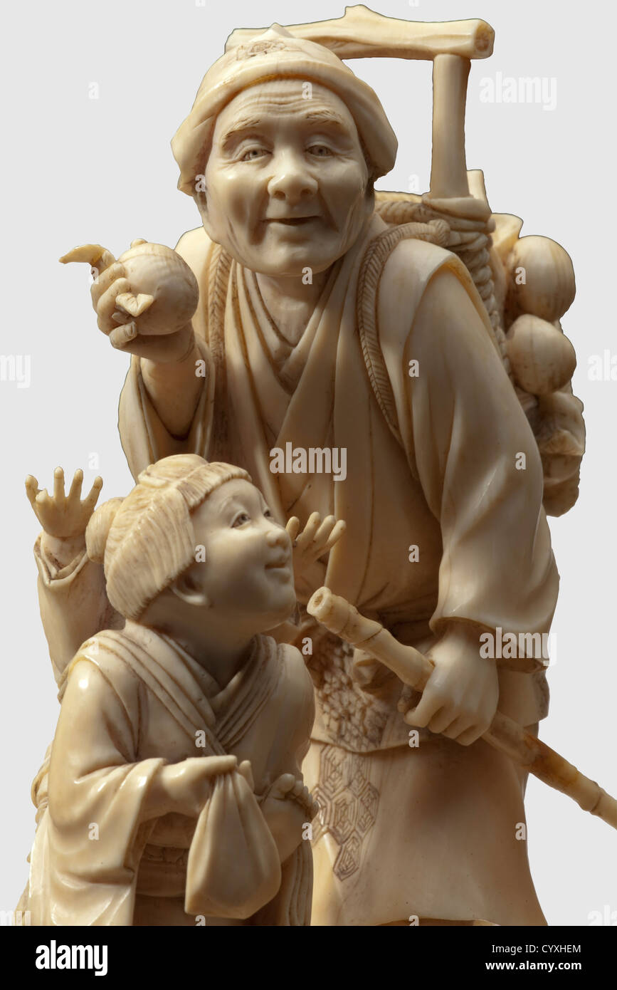 A Japanese okimono,late Meiji period Ivory oval base plate with a ...