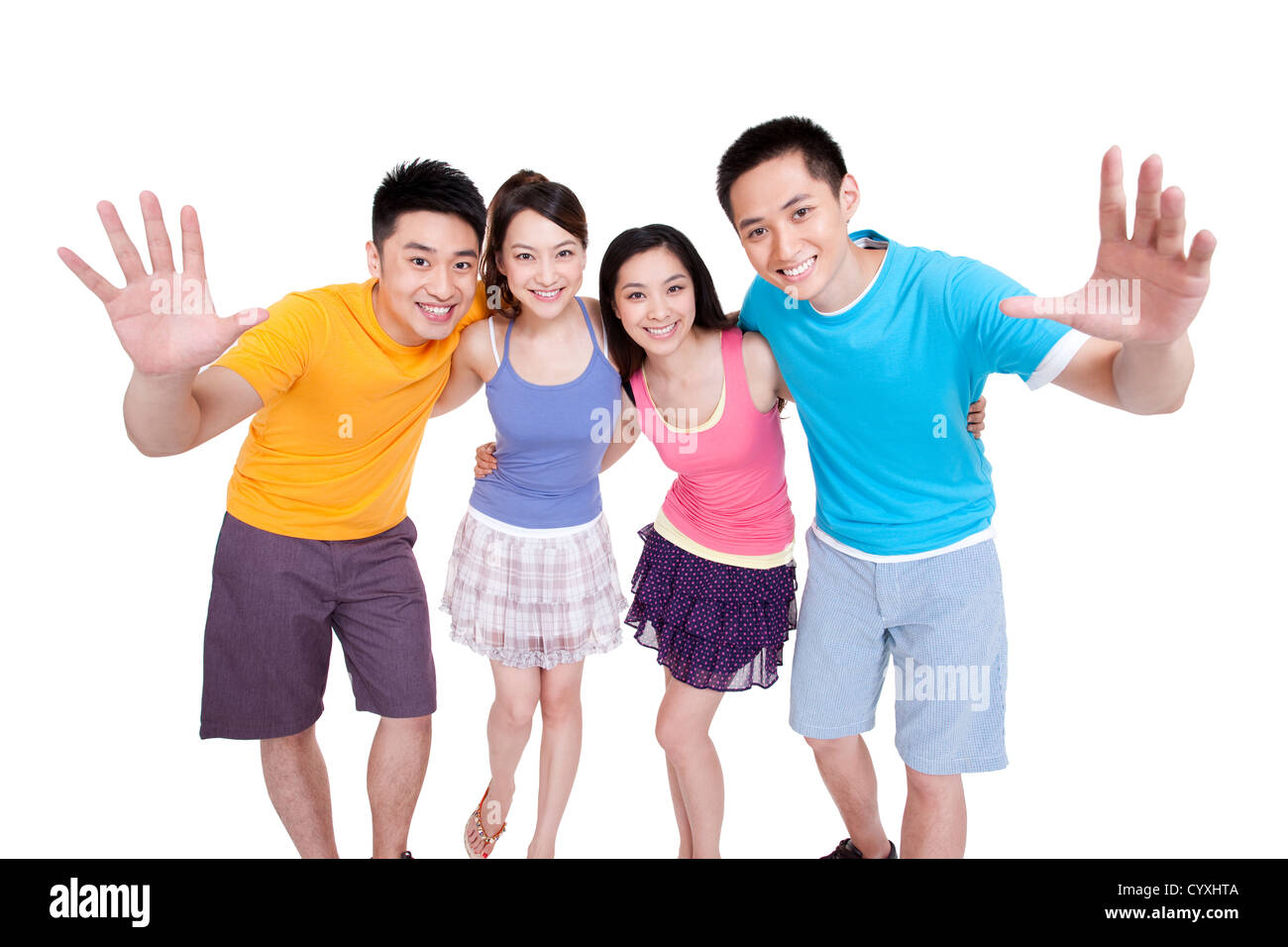 Smiling standing looking at camera greeting arms around hi-res stock ...