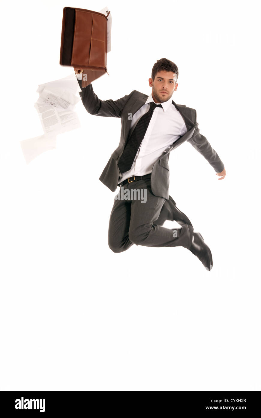 Young businessman jumping with open briefcase falling papers copy-space ...