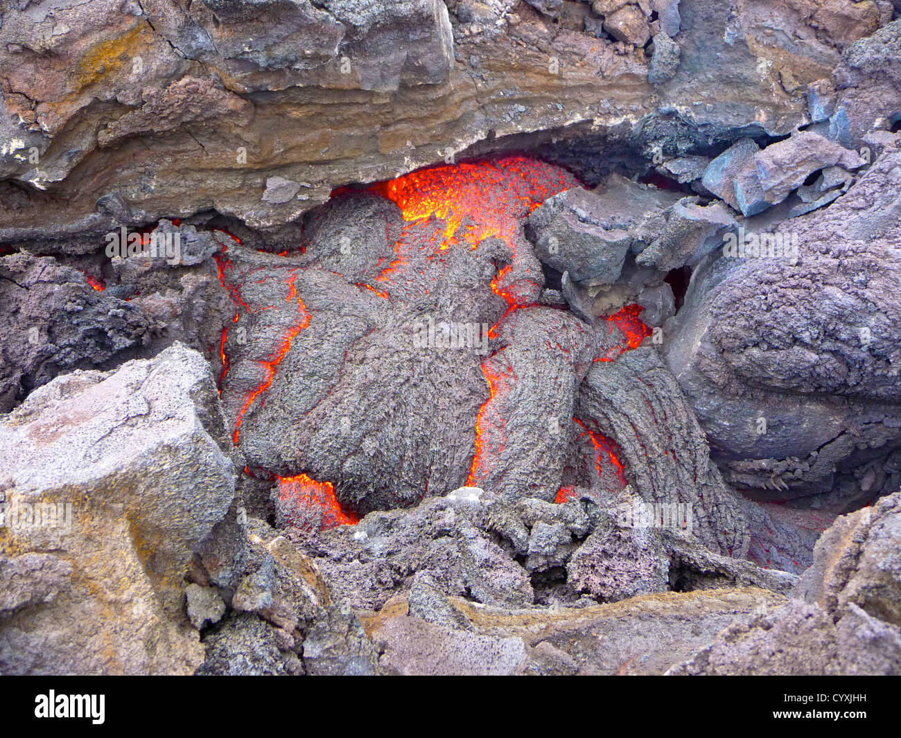 Climbing a fresh lava field in Guatemala - volcanic action Stock Photo ...