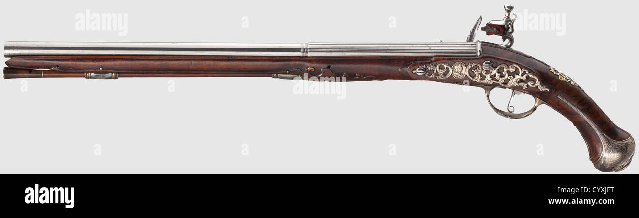 A long Italian flintlock pistol,Italy,circa 1730. Fluted barrel ...