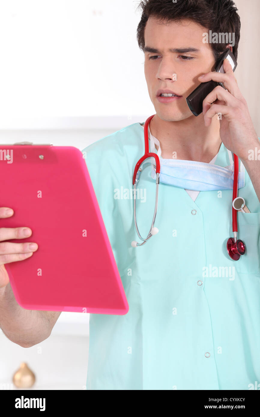 Male nurse holding patient's chart Stock Photo - Alamy