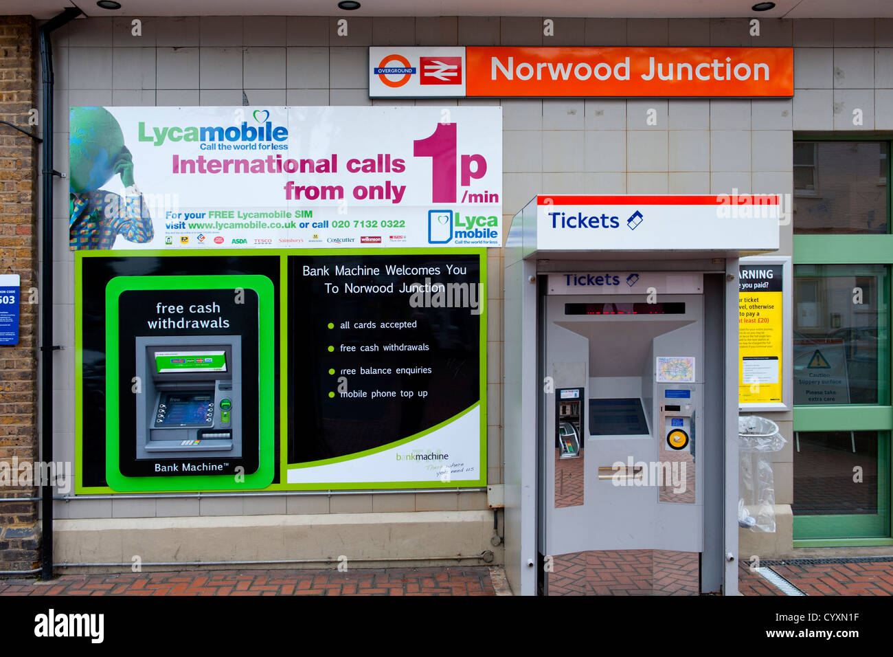 Ticket machine and ATM outside Norwood Junction Railway Station, UK ...