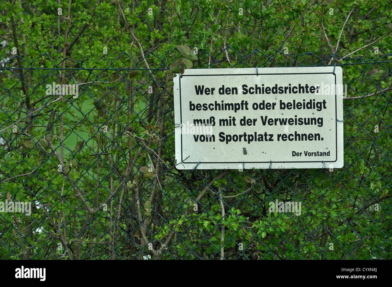 Germany, Bavaria, Close up of German sign at wire mesh fence Stock ...