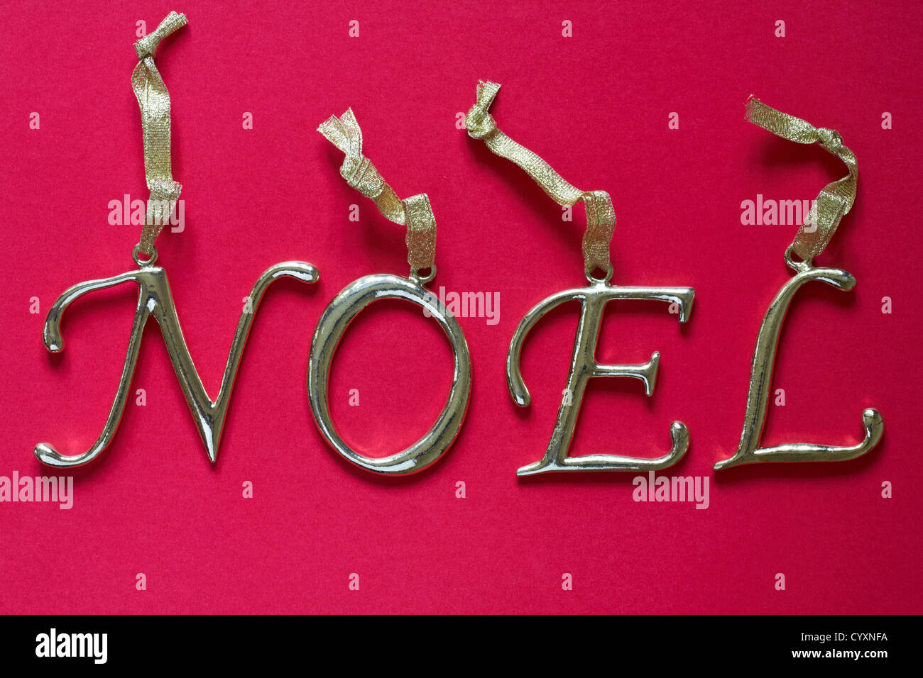 Hanging brass letters spelling noel hi-res stock photography and images ...