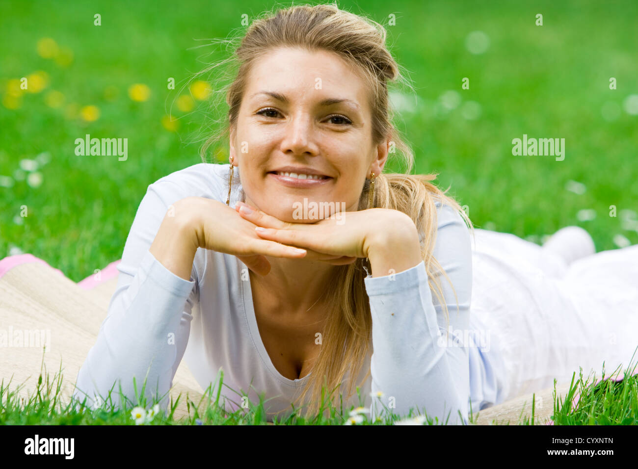 Blonde girl in nature green park relaxing and chilling out Stock Photo ...