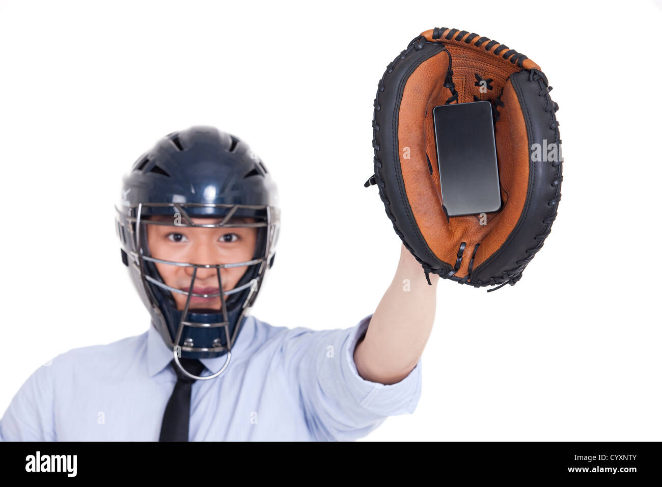 Businessman catching a smart phone Stock Photo - Alamy