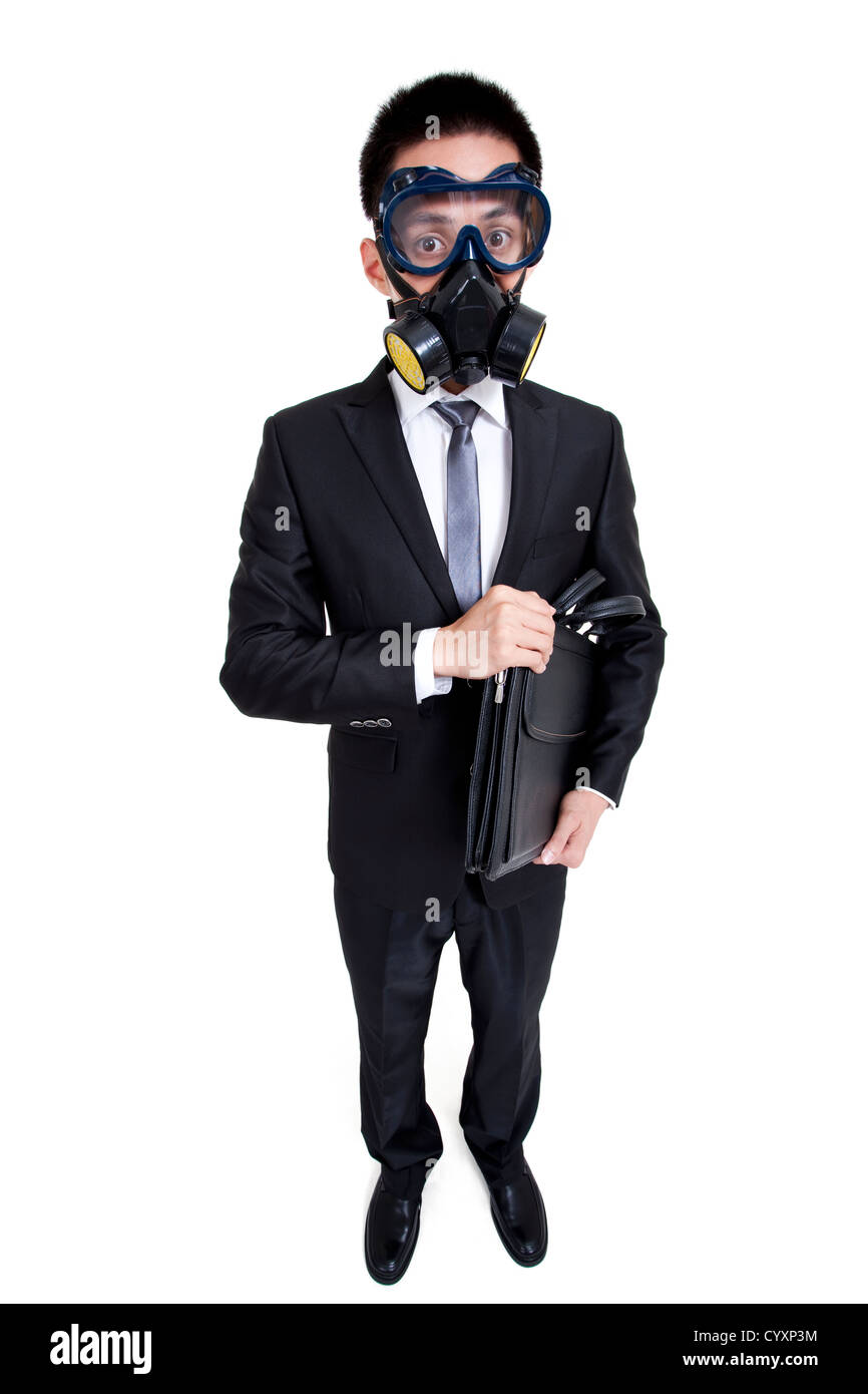 Businessman wearing gas mask Stock Photo - Alamy
