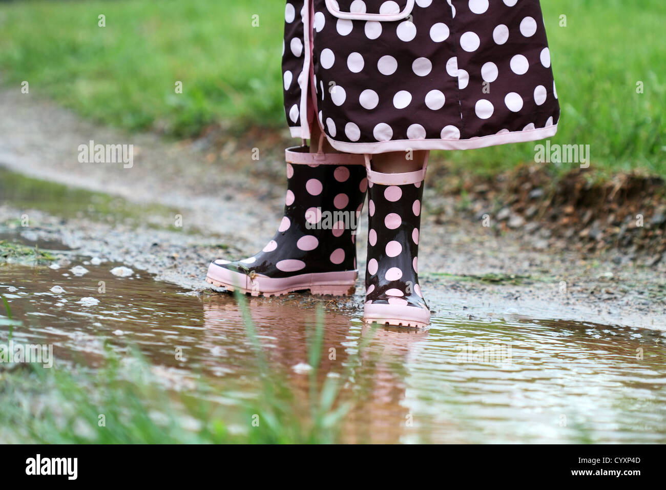Childs feet in puddle hi-res stock photography and images - Alamy