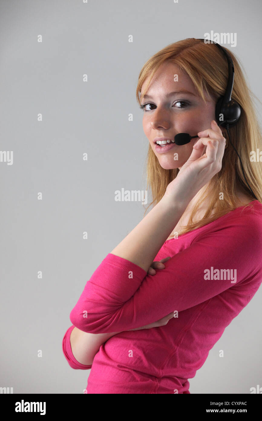 Woman wearing telephone head-set Stock Photo - Alamy