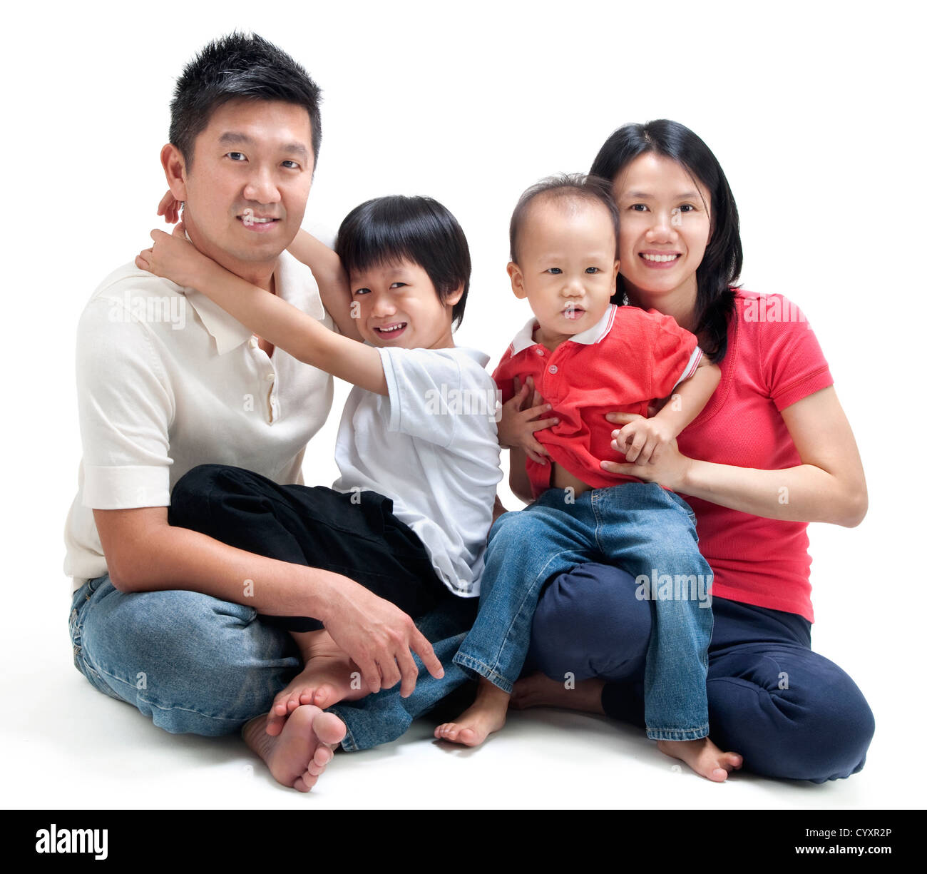 Happy Asian family sitting on white background Stock Photo - Alamy