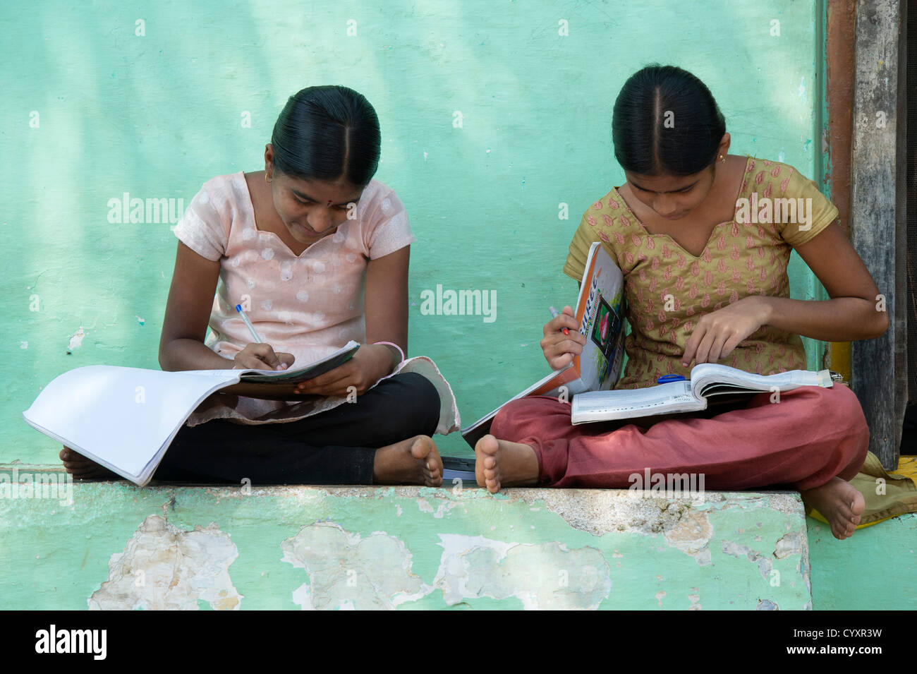 Teenage Indian village girls writing English in school book. Andhra ...